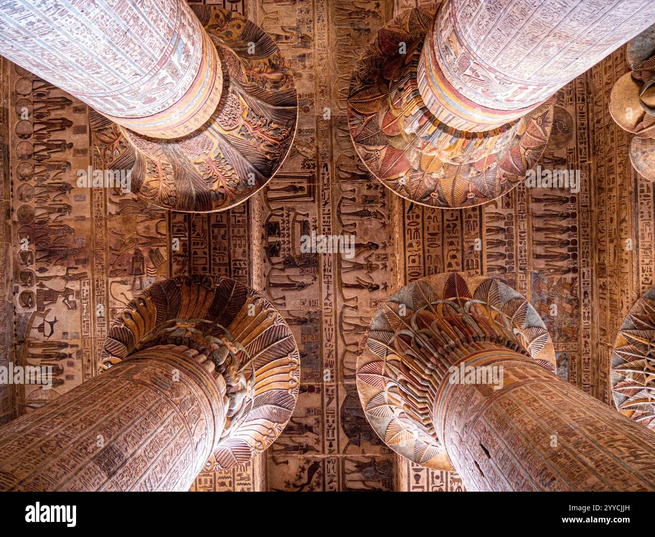 Four pillars and a ceiling covered in hieroglyphic inscriptions inside ...