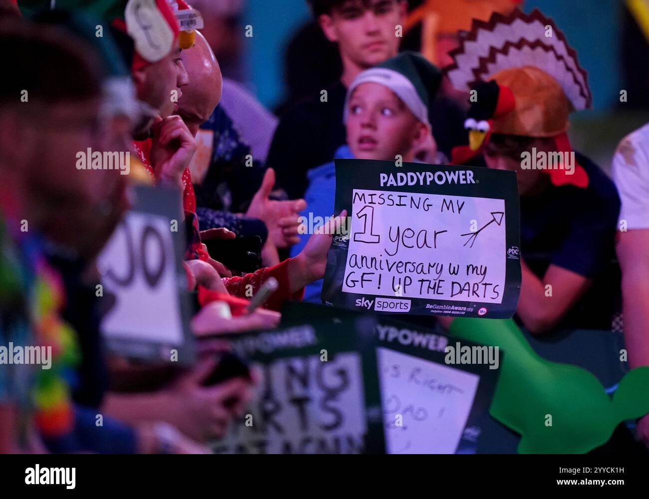 A fan holds up a sign in the crowd during day seven of the Paddy Power ...