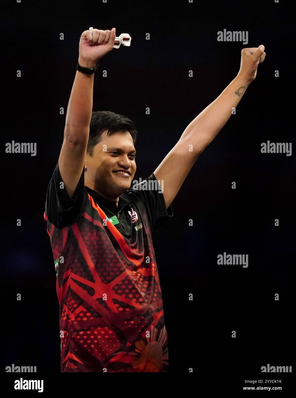 Alexis Toylo celebrates after winning his match against Richard ...
