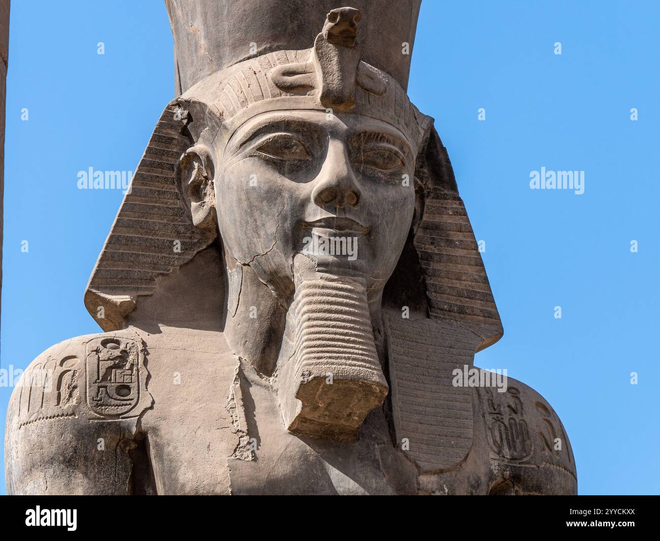 Statue of sitting Ramses II at Luxor Temple, Egypt, on a sunny morning ...