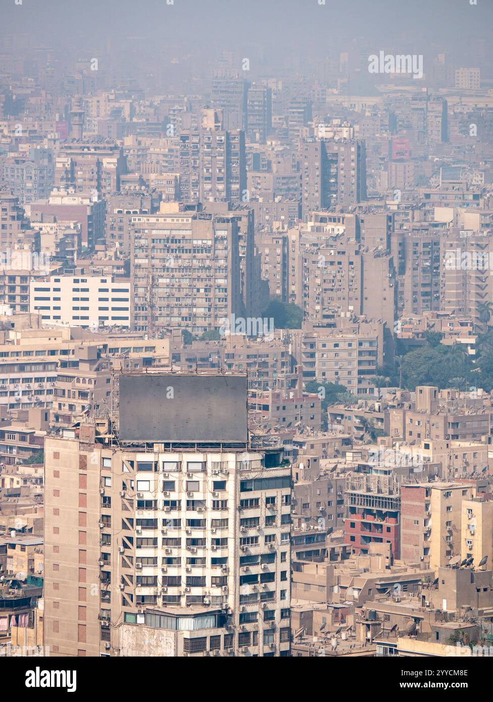 Panoramic views of Cairo's dense cityscape with smog and dust over the ...