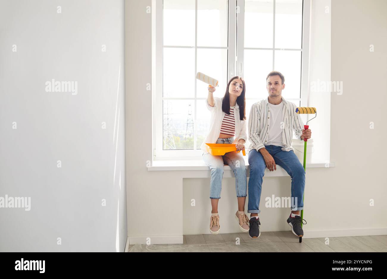 Couple Dreaming Together During Home Renovation And Painting Stock ...