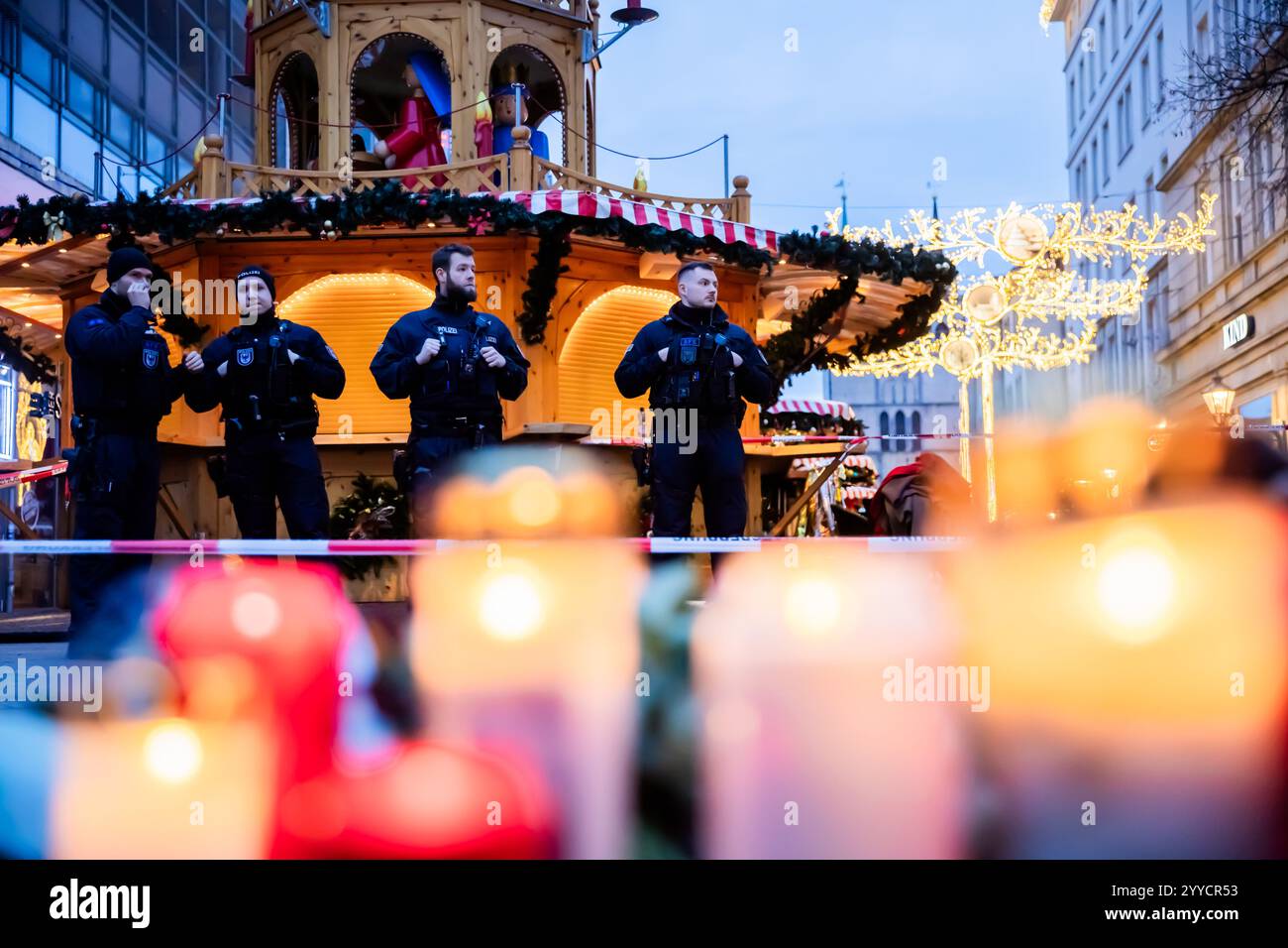 Magdeburg, Germany. 21st Dec, 2024. Police officers secure the ...