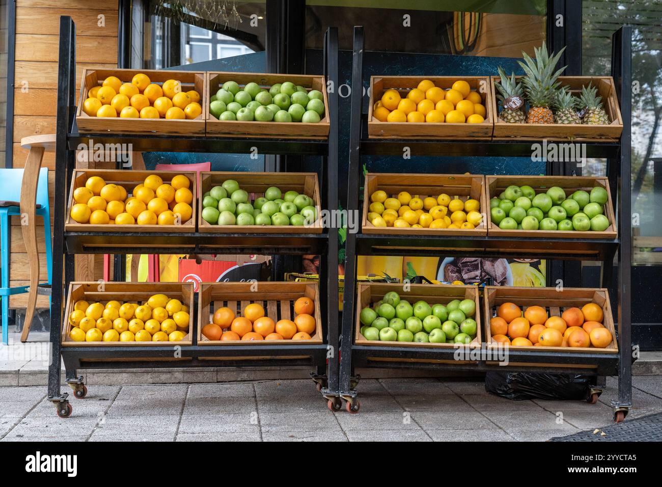 Fresh Finds: Vendor Stalls with Wooden Shelves of Vibrant Fruits at a ...
