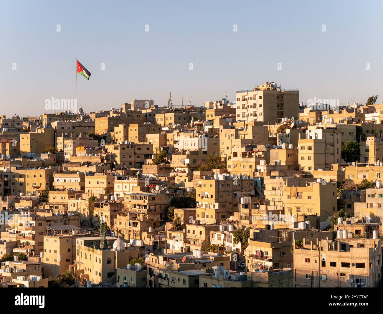 Jordanian flag flying high over Amman, Jordan during sunset - Landscape ...