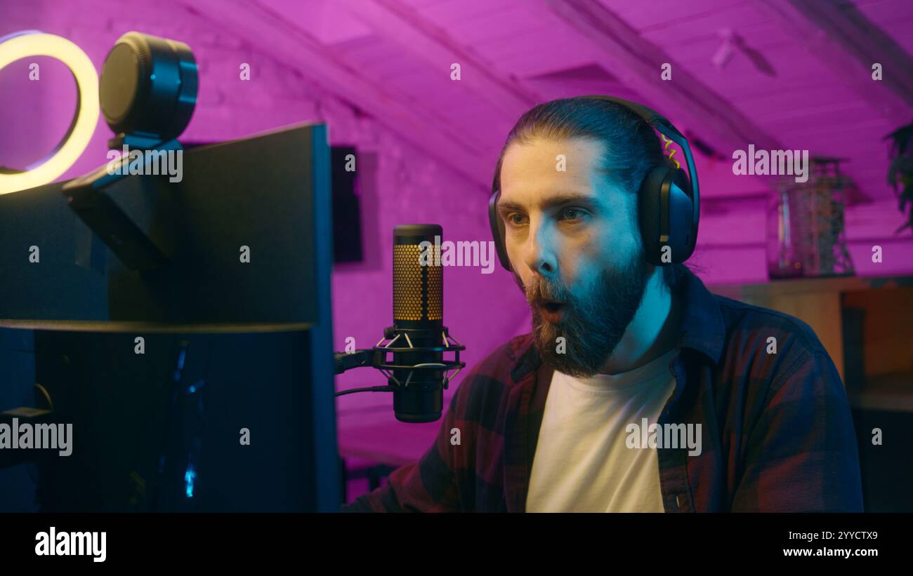 Shocked Caucasian man angry vlogger talking microphone mic addicted ...