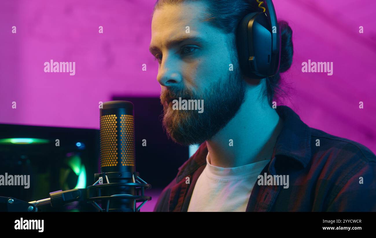 Addict Caucasian man guy streamer vlogger putting on headphones male ...