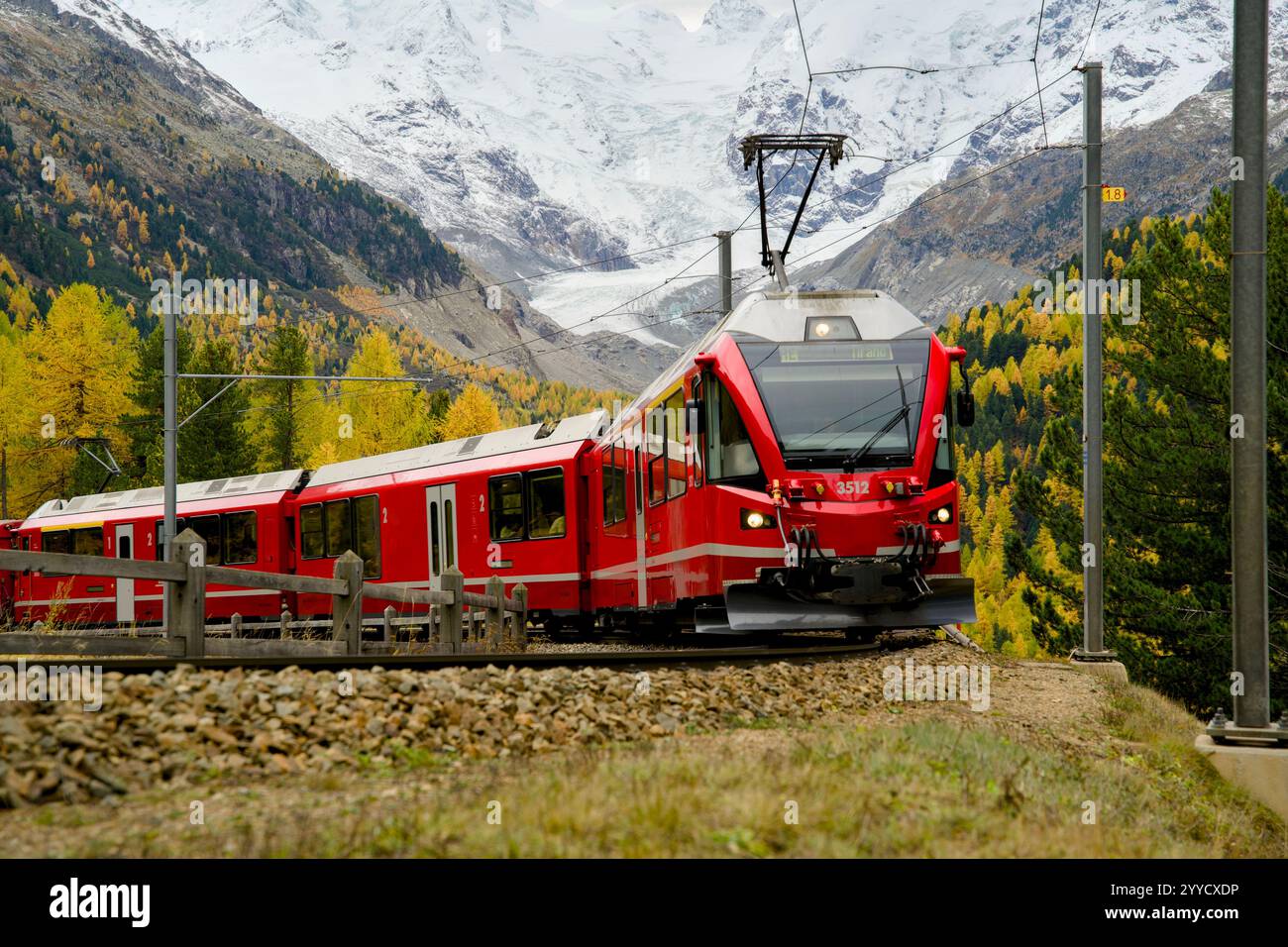 Red swiss train Rhaetische Bahn in the mountains of Graubünden ...