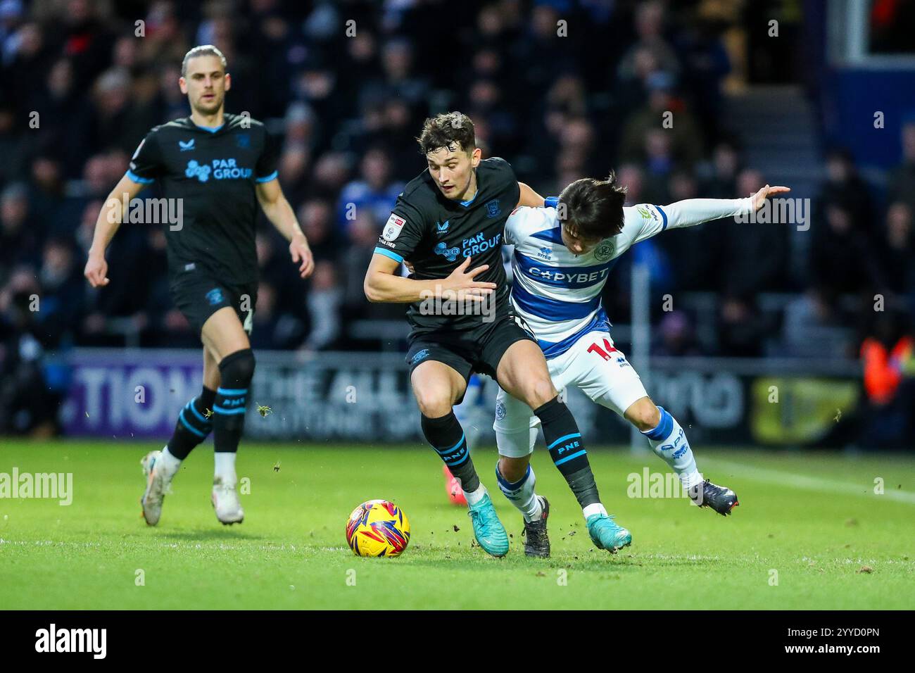 Jordan Storey of Preston North End battles for the ball with Koki Saito ...