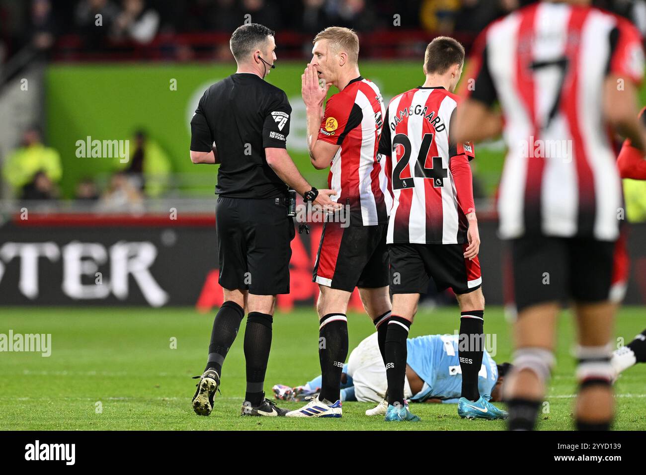Referee, Michael Oliver has words with Ben Mee of Brentford after ...