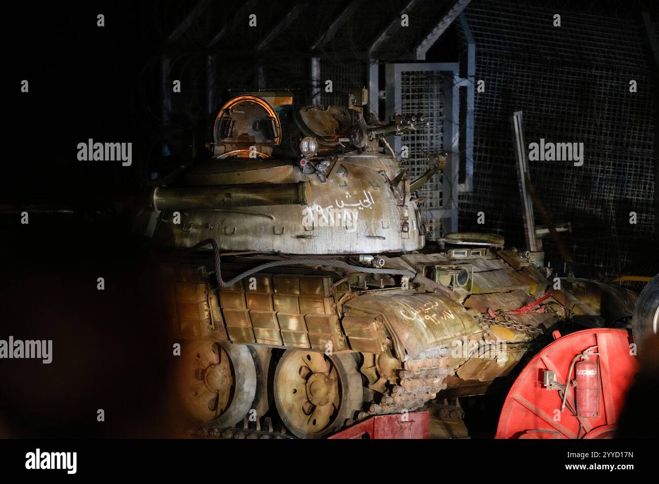 An Israeli truck carries a Syrian tank with a message that reads in ...