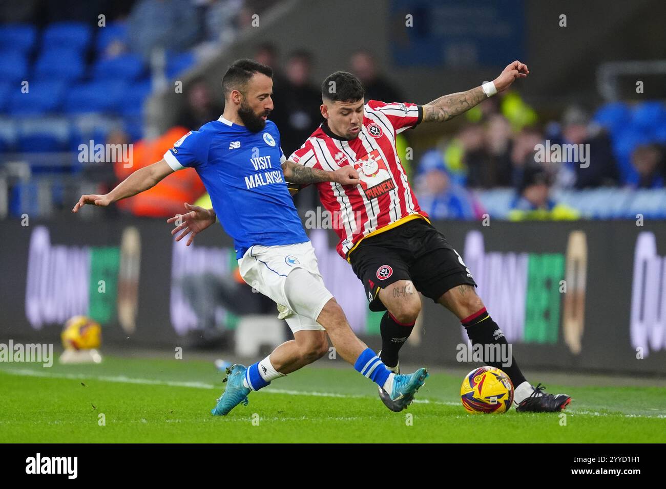 Sheffield United's Gustavo Hamer (right) and Cardiff City's Manolis ...