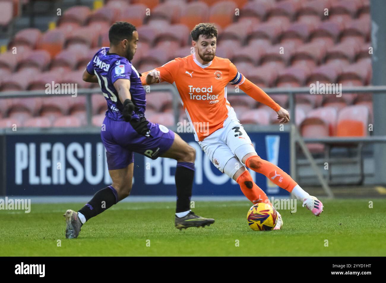 James Husband of Blackpool takes on Louis Thompson of Stevenage during ...