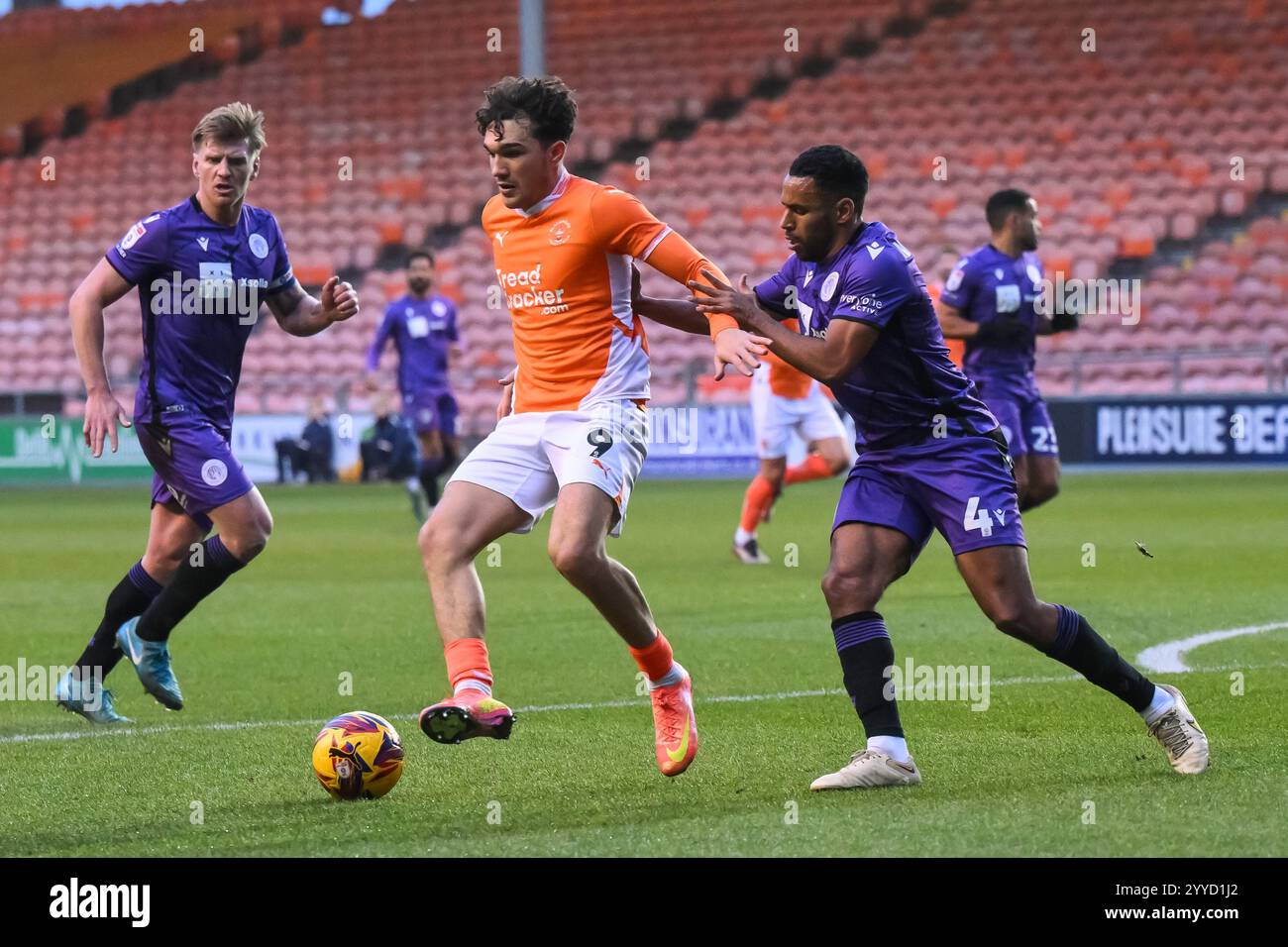 Kyle Joseph of Blackpool holds off Nathan Thompson of Stevenage during ...