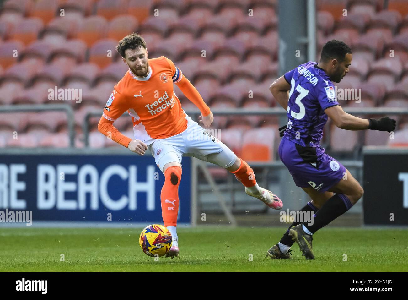 James Husband of Blackpool is fouled by Louis Thompson of Stevenage ...