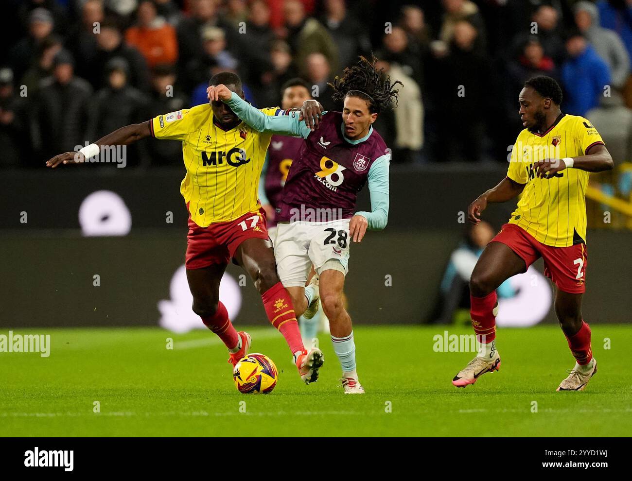 Watford's Moussa Sissoko (left) and Burnley's Hannibal Mejbri (centre ...