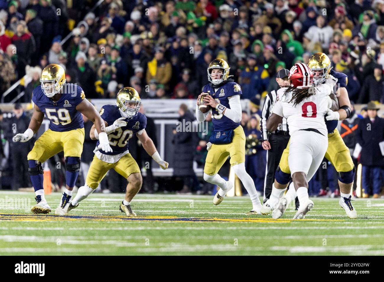 South Bend, Indiana, USA. 20th Dec, 2024. Notre Dame quarterback Riley Leonard (13) surveys the ...