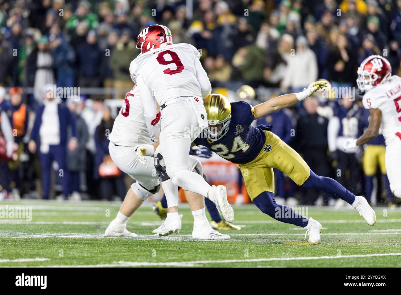 South Bend, Indiana, USA. 20th Dec, 2024. Notre Dame linebacker Jack Kiser (24) makes the tackle ...