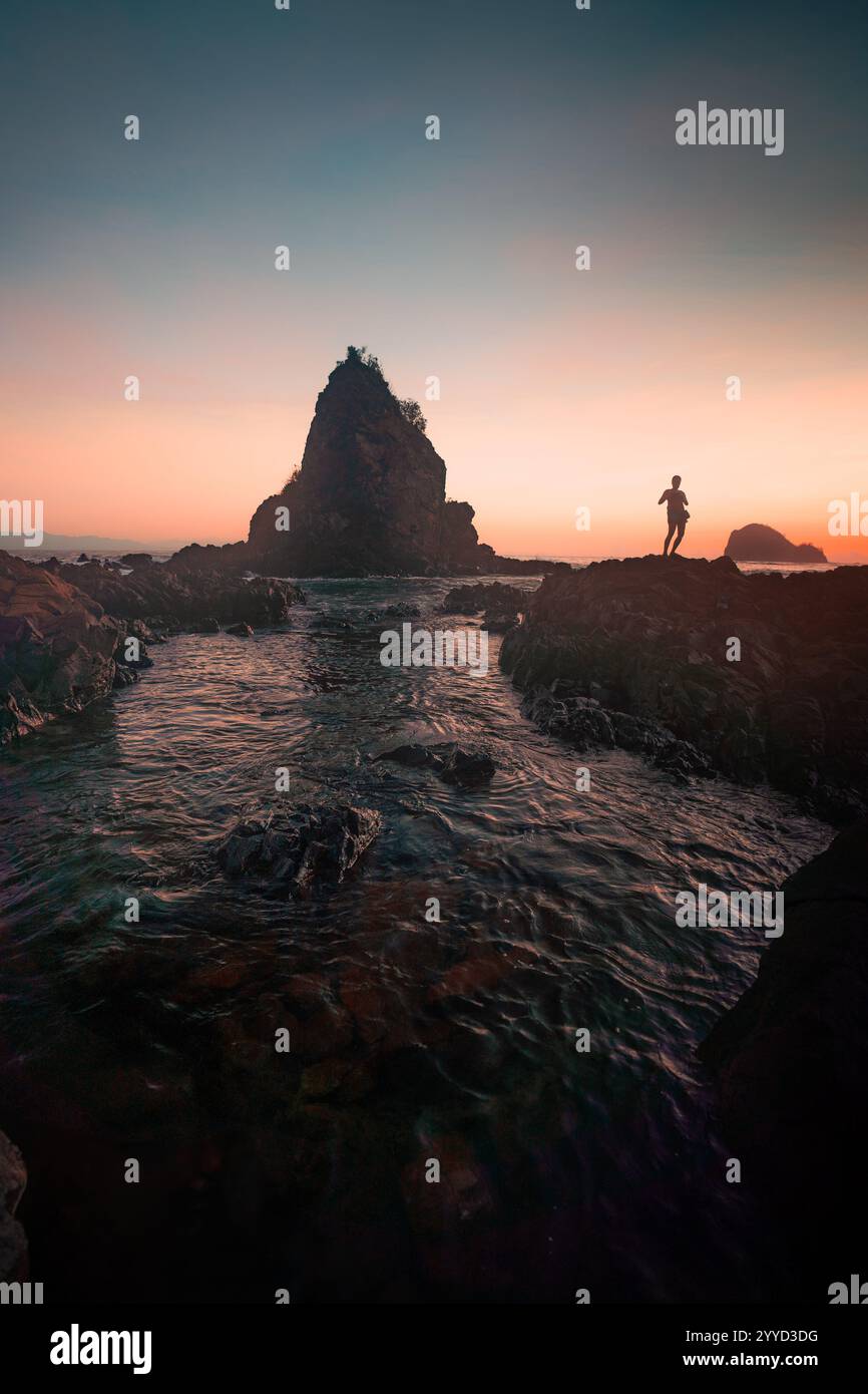 A breathtaking view of Diguisit Rock Formation at sunset, where rugged ...
