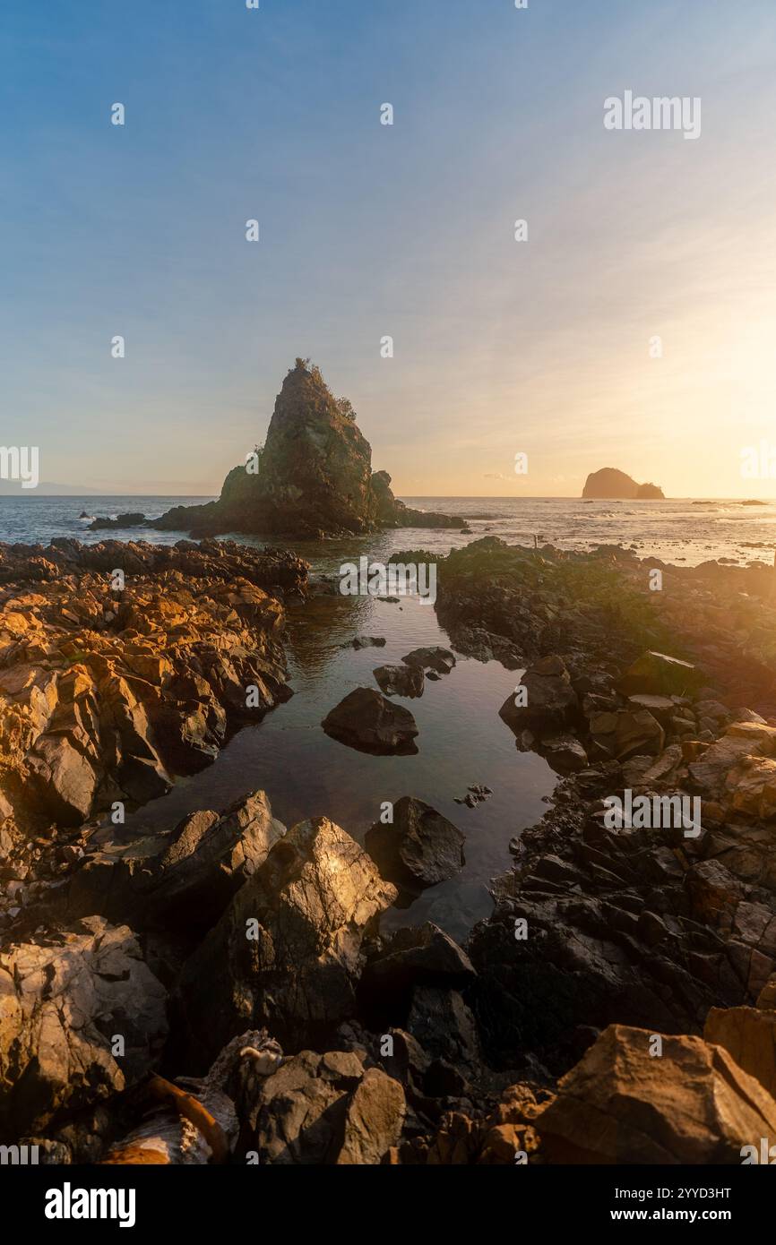 A breathtaking view of Diguisit Rock Formation at sunset, where rugged ...