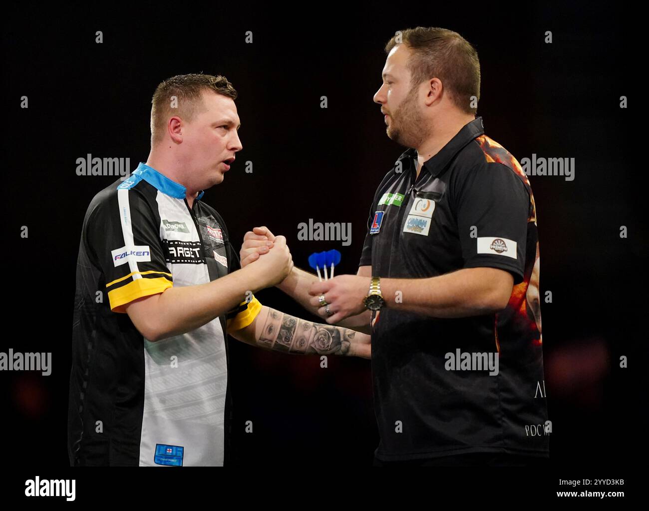 Chris Dobey (left) shakes hands with Alexander Merkx after winning ...