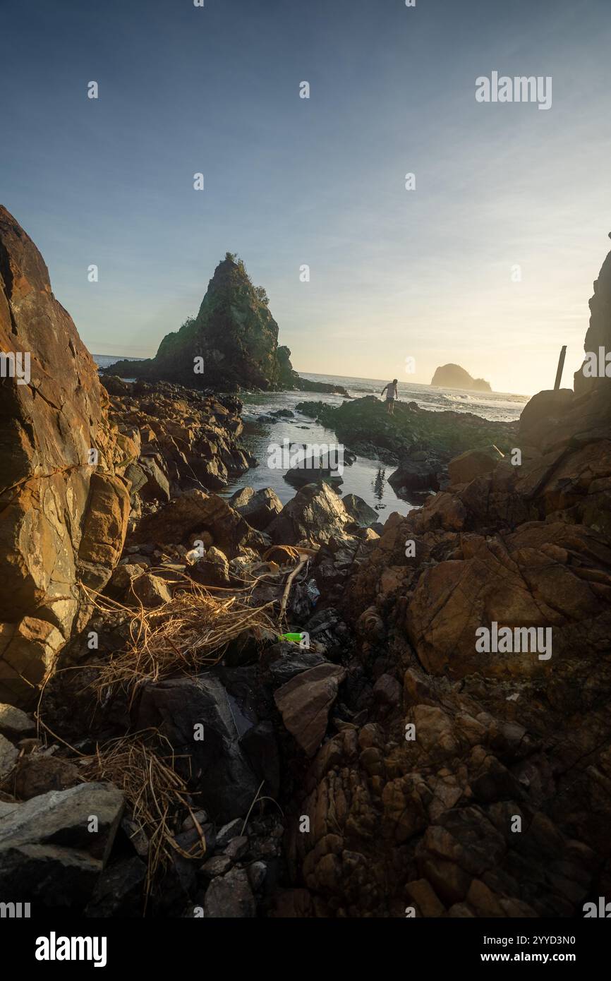 A breathtaking view of Diguisit Rock Formation at sunset, where rugged ...