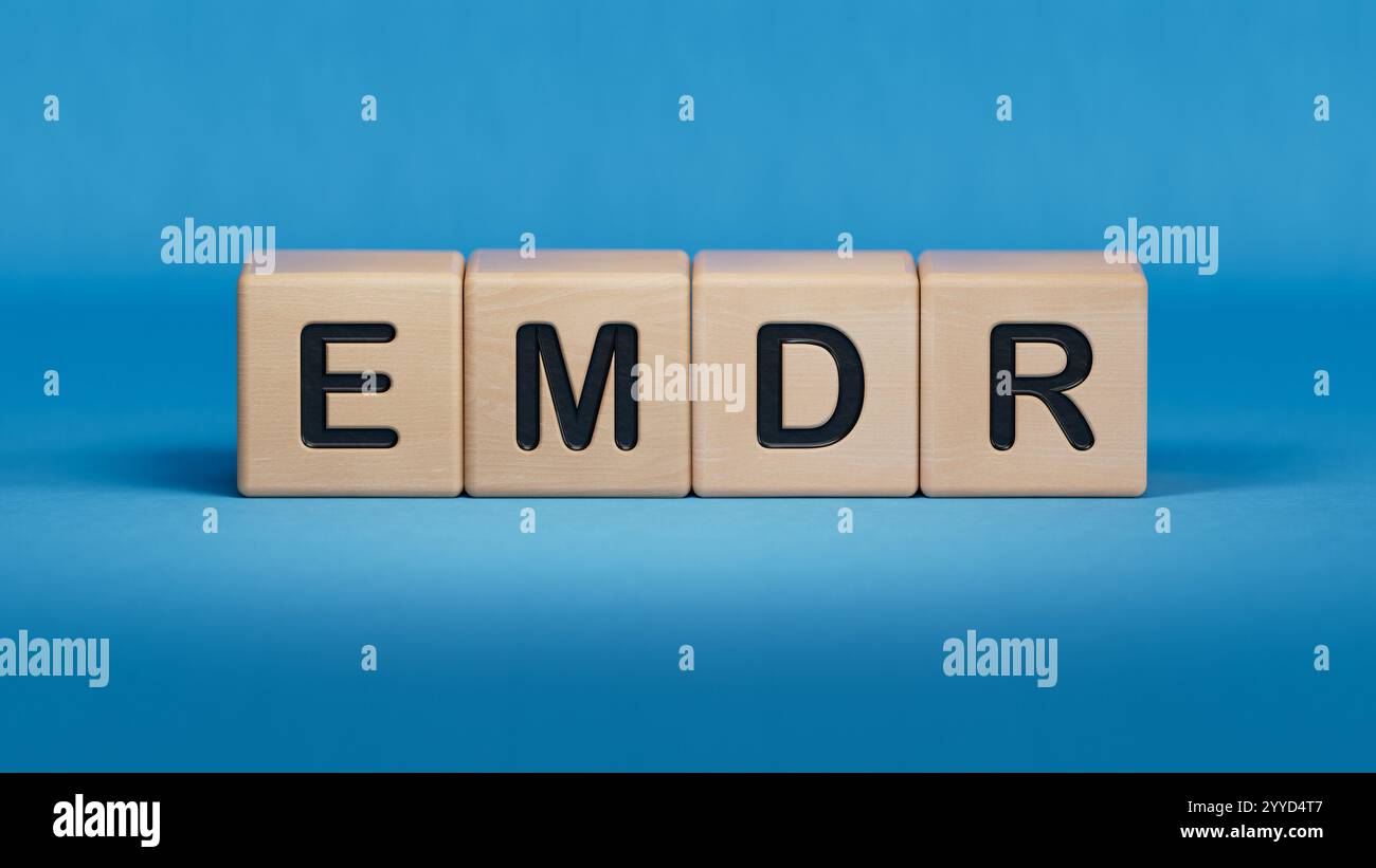 The text EMDR word Eye Movement Desensitization is written on notepad ...