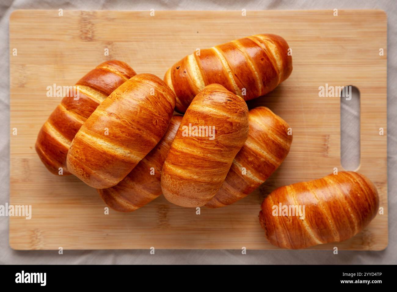 Homemade Sausage Buns on a bamboo board, top view. Flat lay, overhead ...