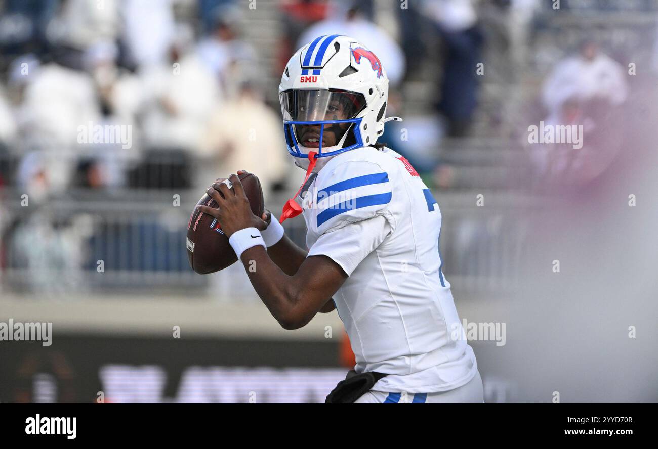 SMU quarterback Kevin Jennings warms up for the game against Penn State ...