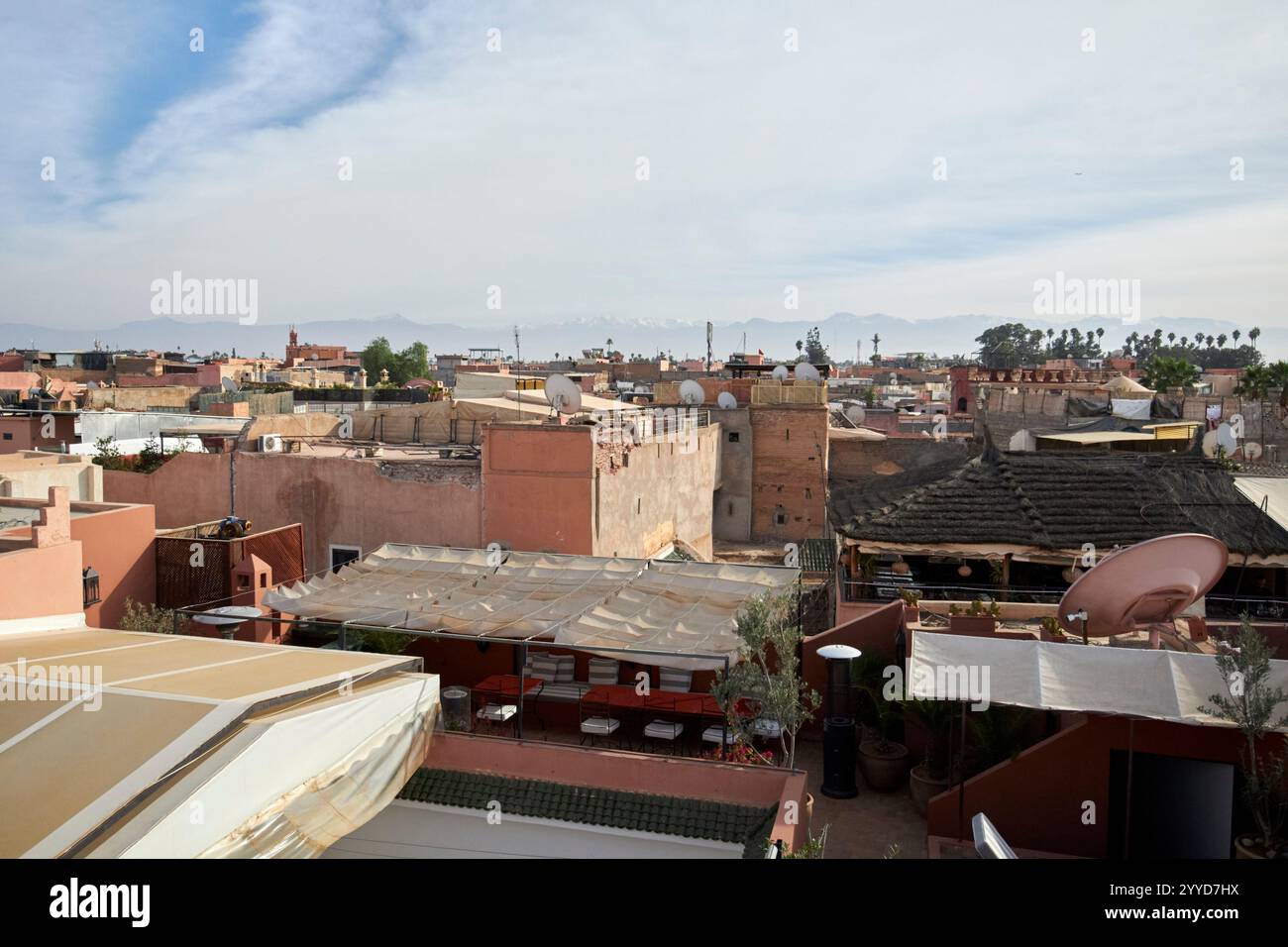 looking over the rooftops of the medina of marrakesh towards the snow ...