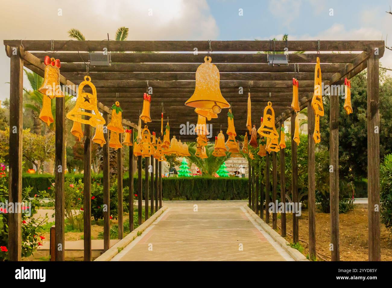 Festive Decorations with Hanging Bells in Outdoor Holiday Themed Park ...