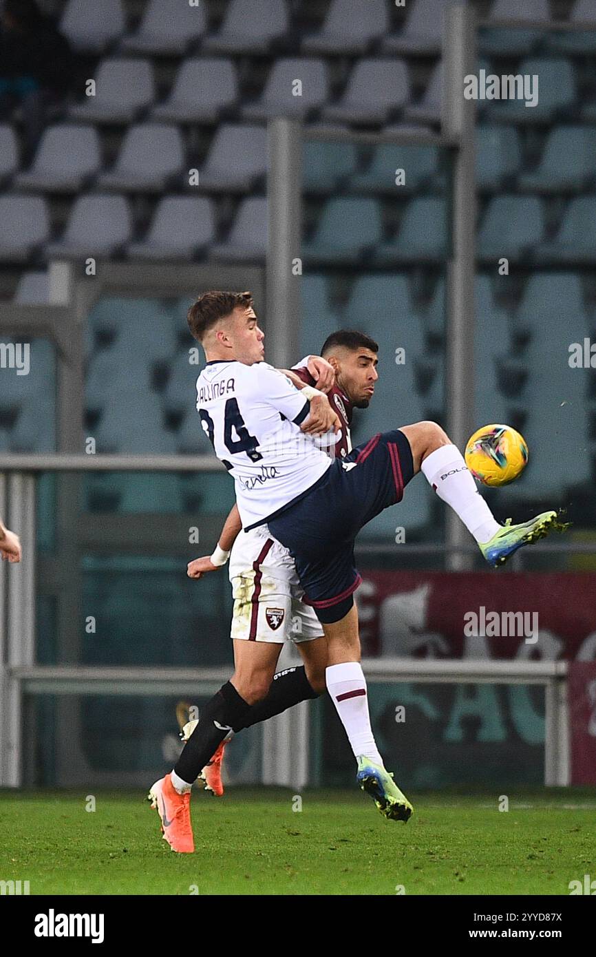 Turin, Italia. 21st Dec, 2024. Torino's Adam Masina battles for the ...