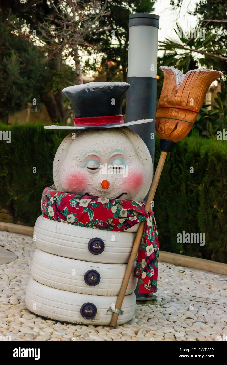 Creative Snowman Sculpture Made From Tires Decorated for the Winter ...