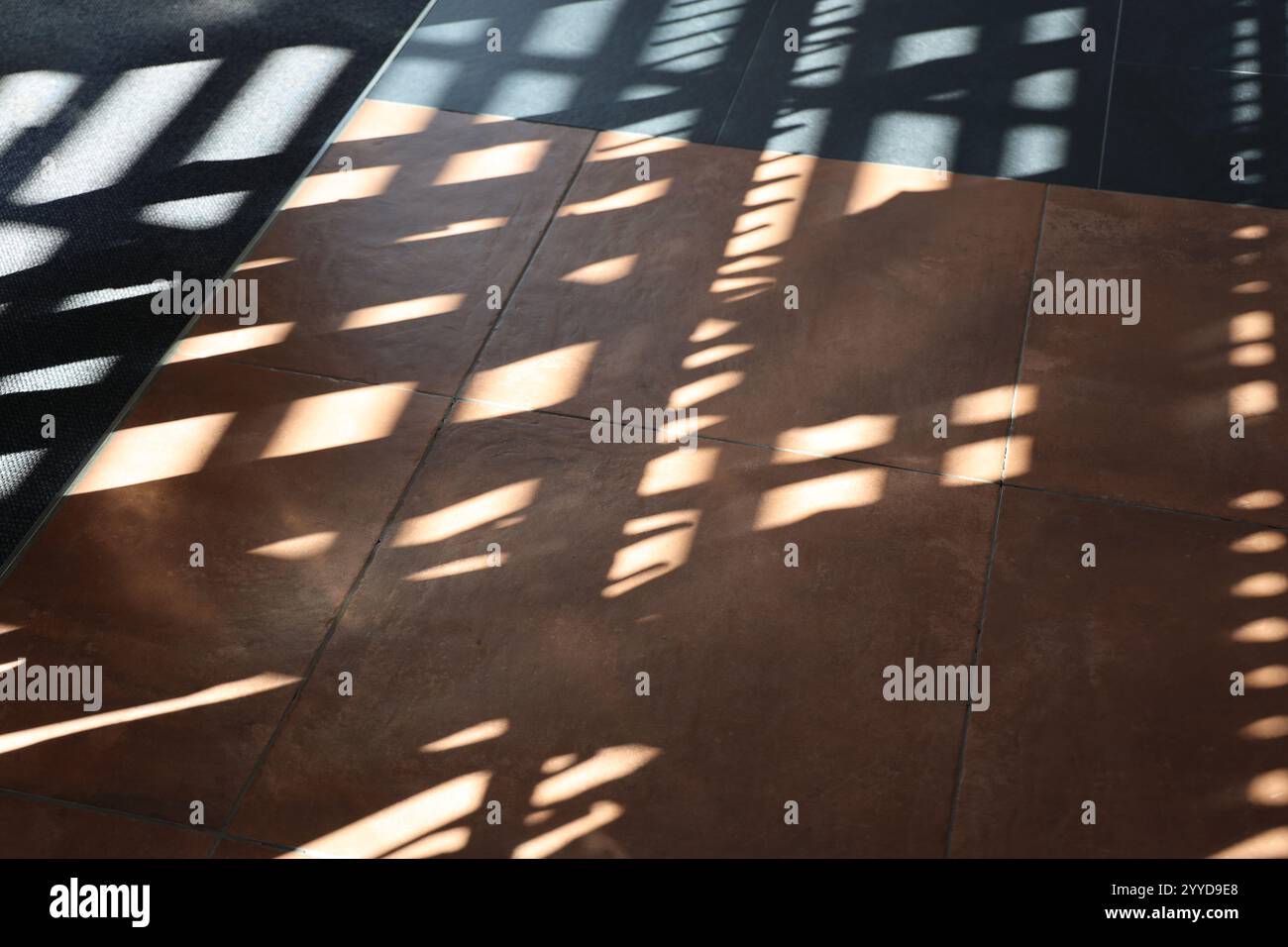 Shadows lights. Light and shade background through a sun protection ...