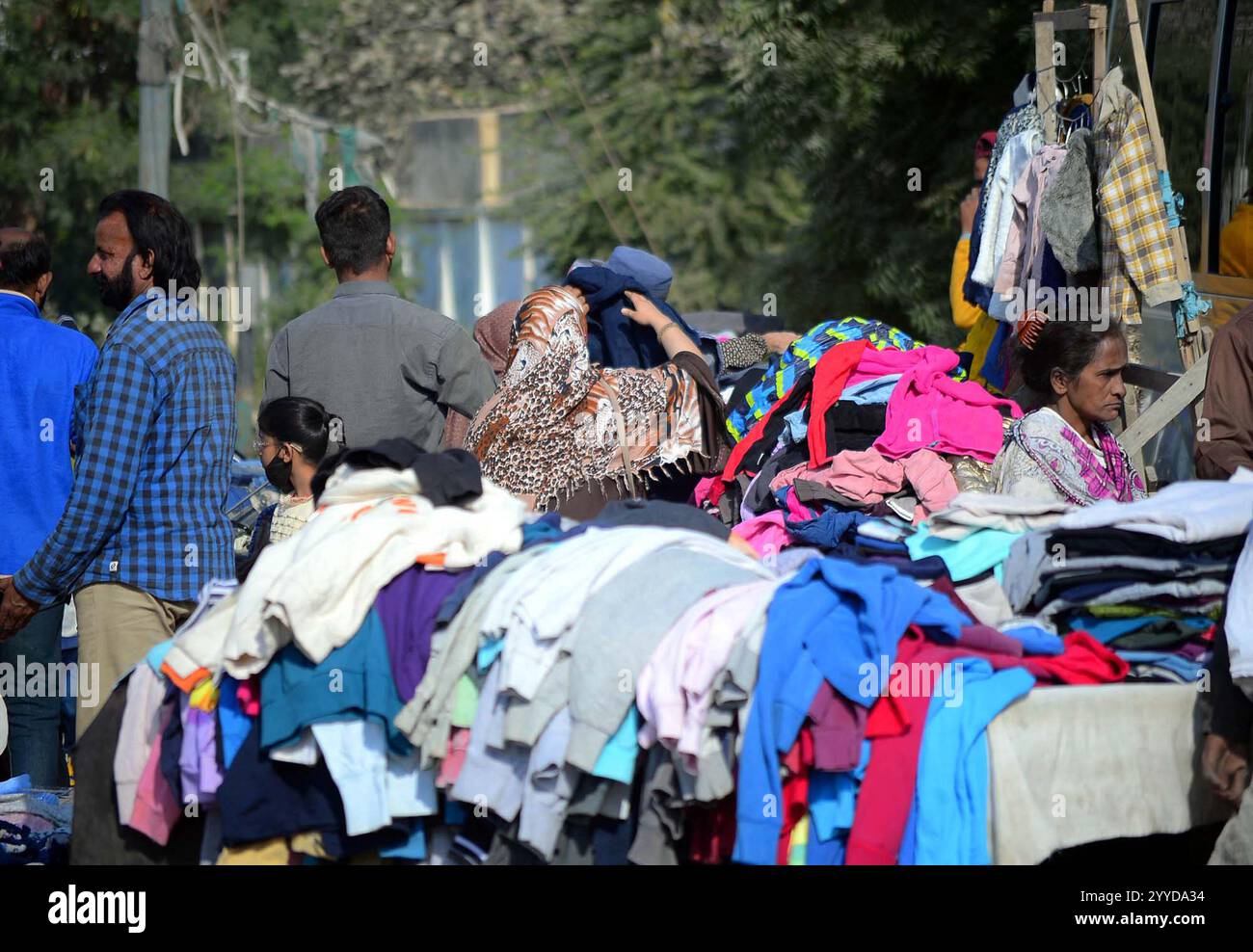 Warm clothes are being selling at roadside stalls as the demand of warm ...