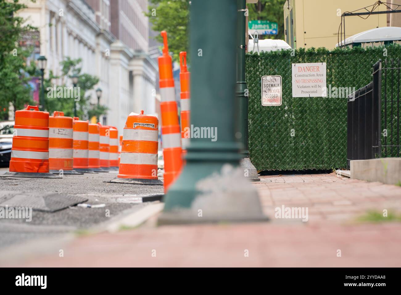July 19 2023. Construction work blocks pedestrian access on a sidewalk ...