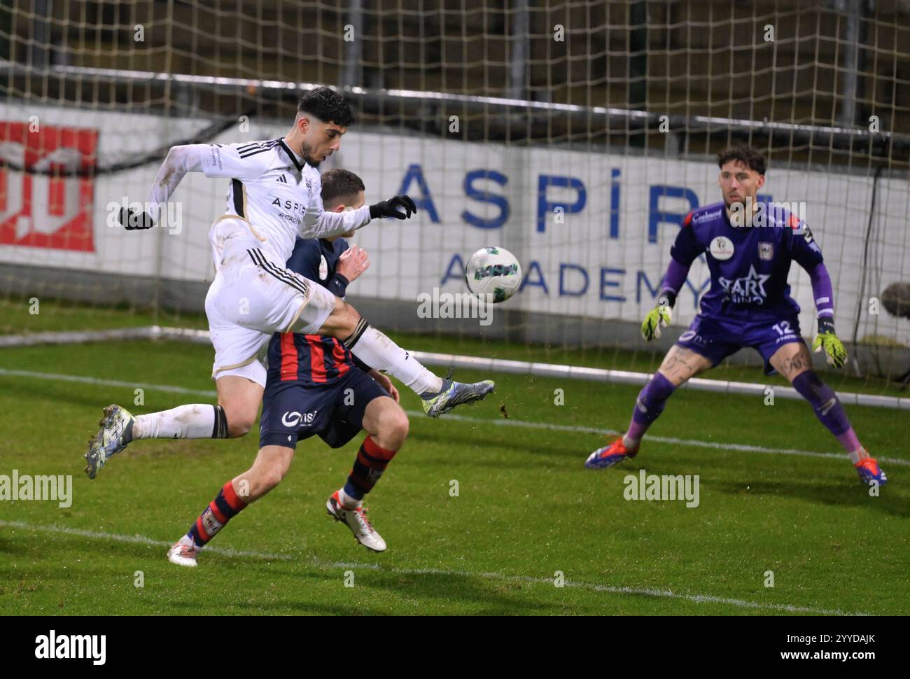 Eupen, Belgium. 21st Dec, 2024. Eupen's Emrehan Gedikli fights for the ball during a soccer ...