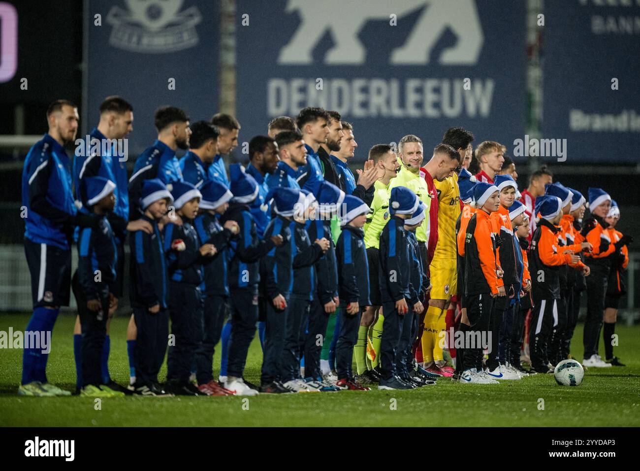 Denderleeuw, Belgium. 21st Dec, 2024. Dender's players and Antwerp's ...