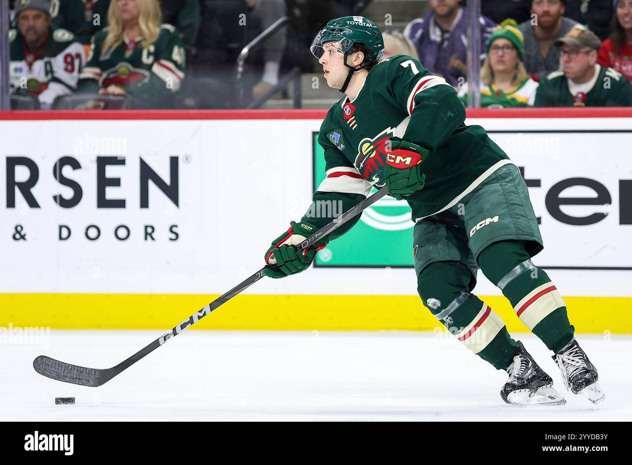 Minnesota Wild defenseman Brock Faber (7) skates with the puck during ...