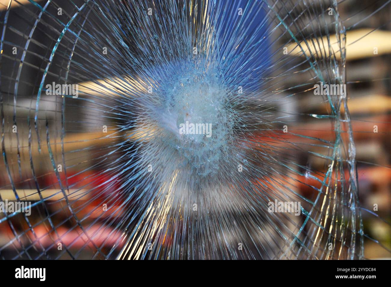 Reflection on stained glass window broken by attempted robbery Stock ...