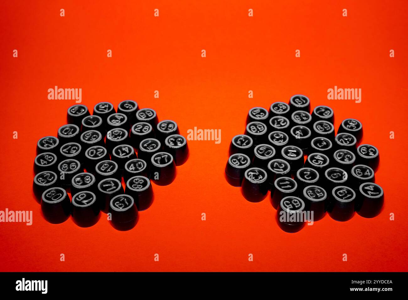 Black numeric tiles are organized into two clusters, contrasting ...