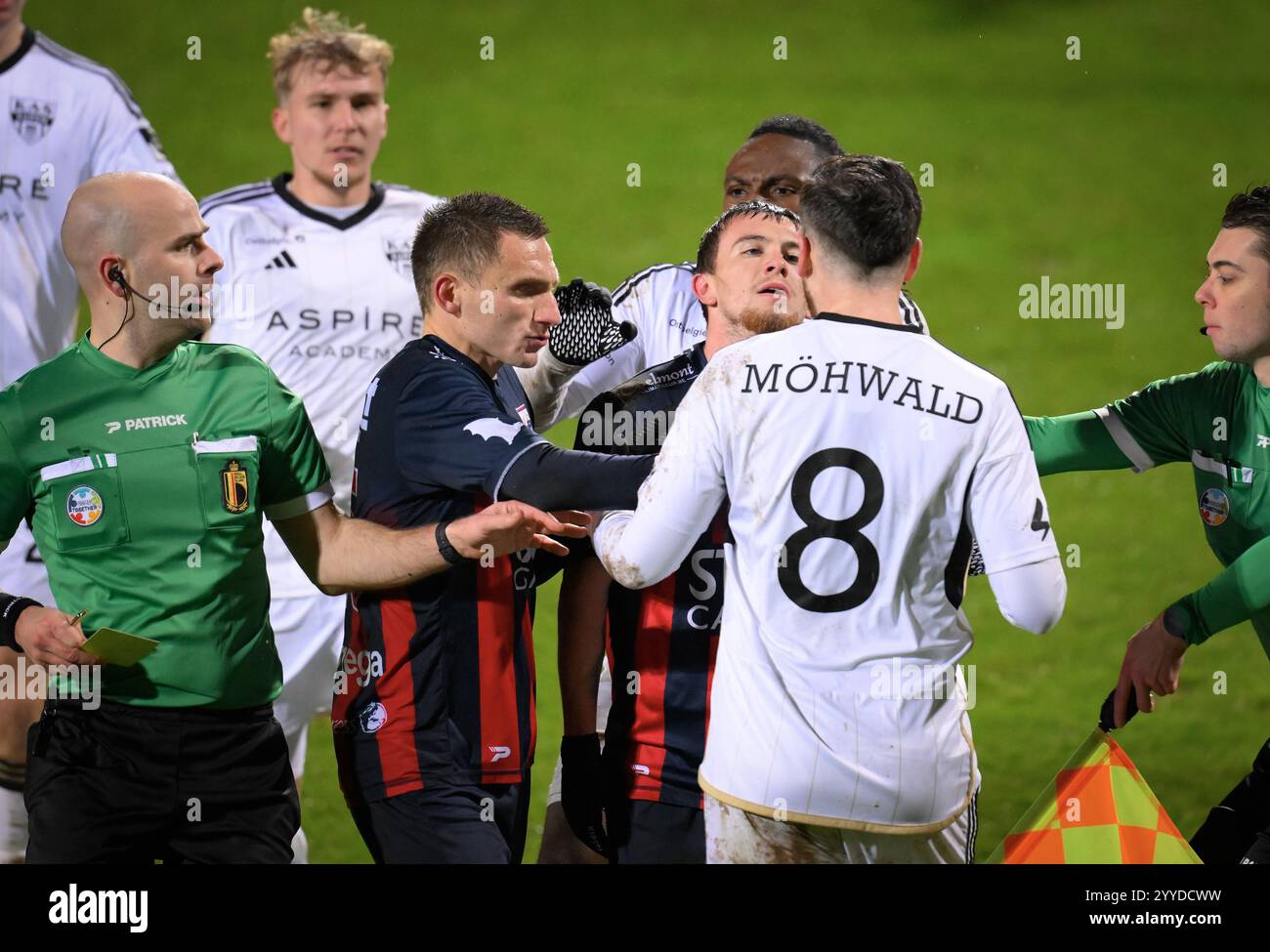 Eupen, Belgium. 21st Dec, 2024. Liege's Alexis Lefebvre, Liege's Theo Pierrot and Eupen's Kevin ...