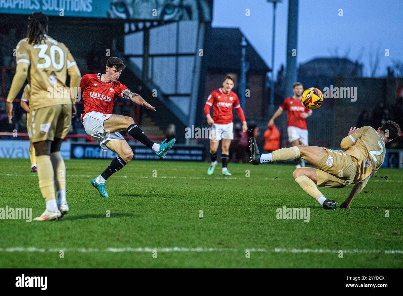 Callum Reynolds of Bromley FC blocks Morecambe FC's Harvey Macadam shot ...