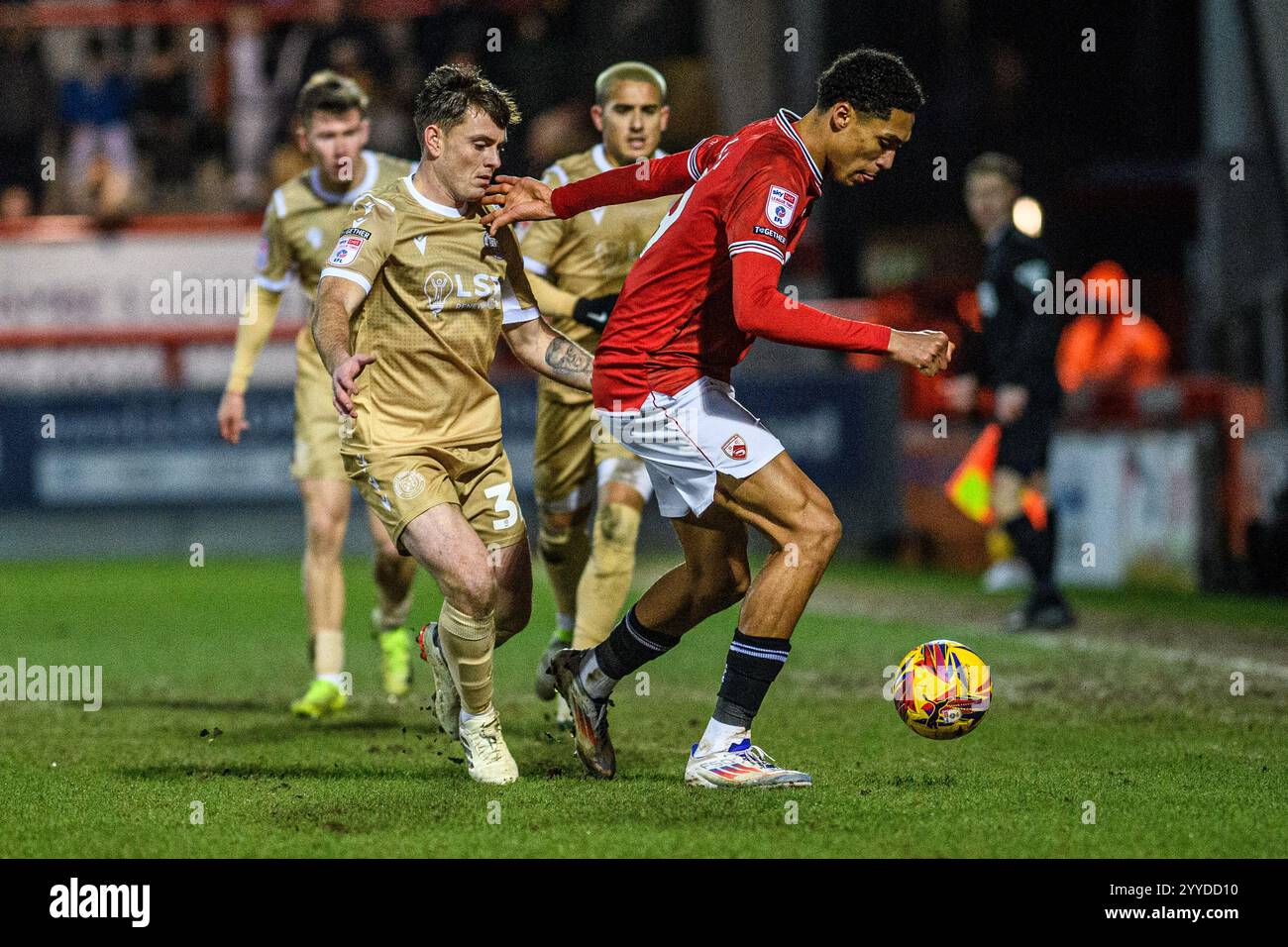 Morecambe FC's Marcus Dackers under pressure fromBen Thompson of ...