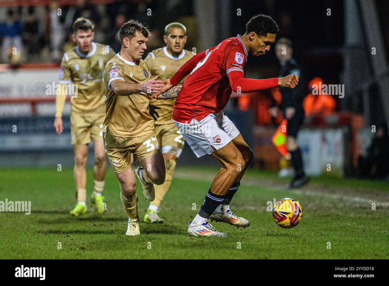 Morecambe FC's Marcus Dackers under pressure fromBen Thompson of ...