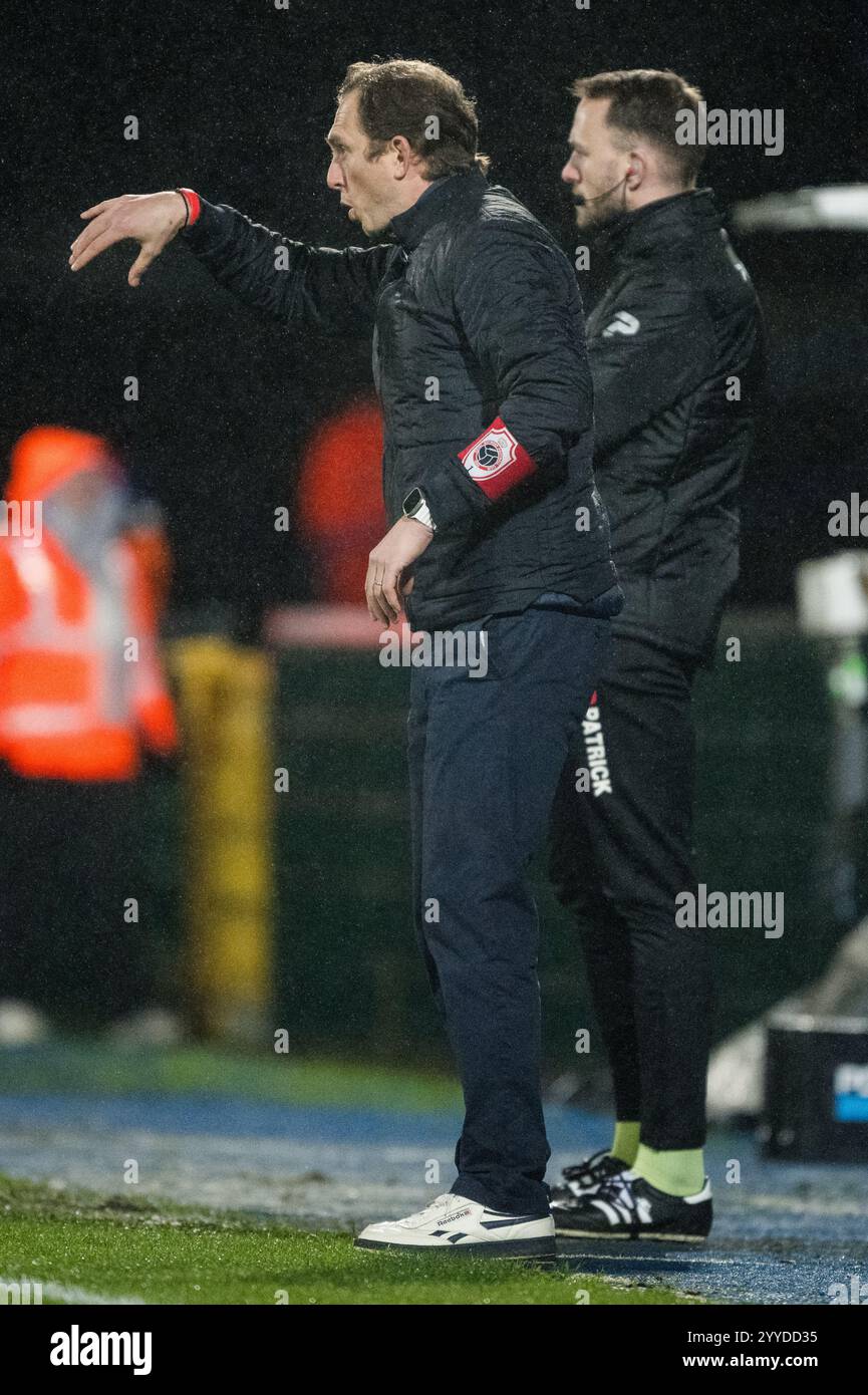 Denderleeuw, Belgium. 21st Dec, 2024. Antwerp's head coach Jonas De Roeck reacts during a soccer ...