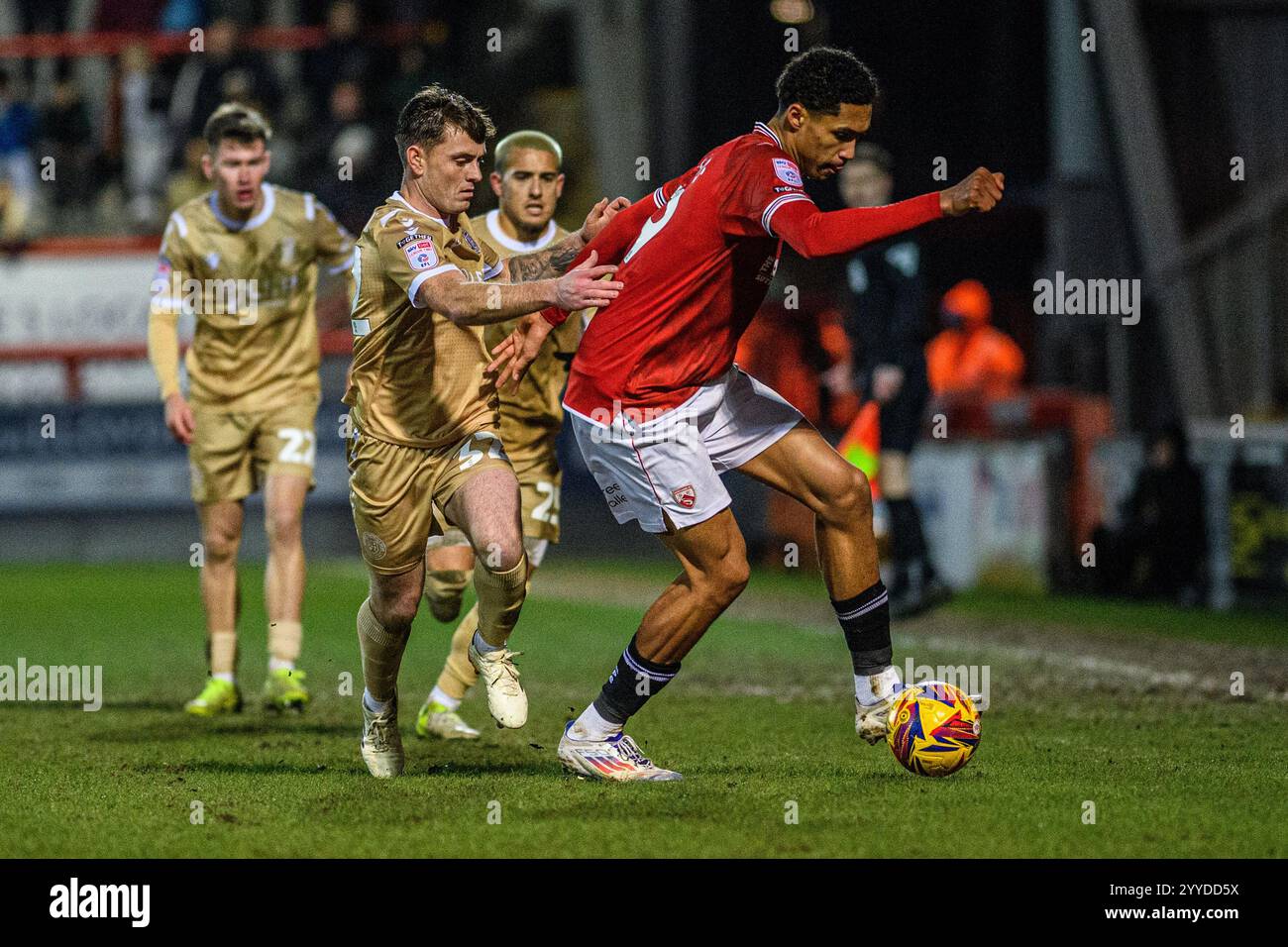 Morecambe FC's Marcus Dackers under pressure fromBen Thompson of ...