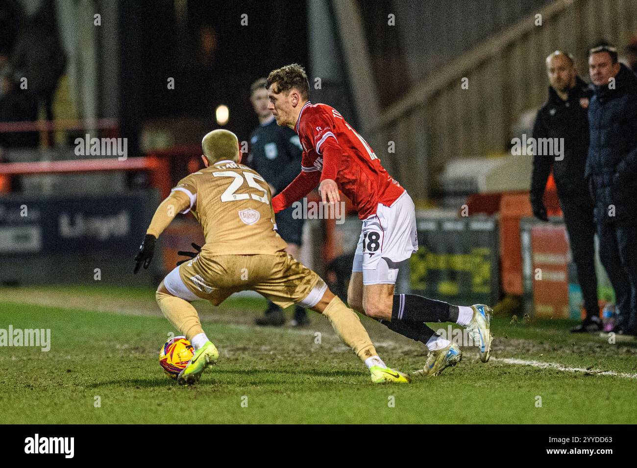 Morecambe FC's Ben Tollitt tackles Danny Imray of Bromley FCduring the ...
