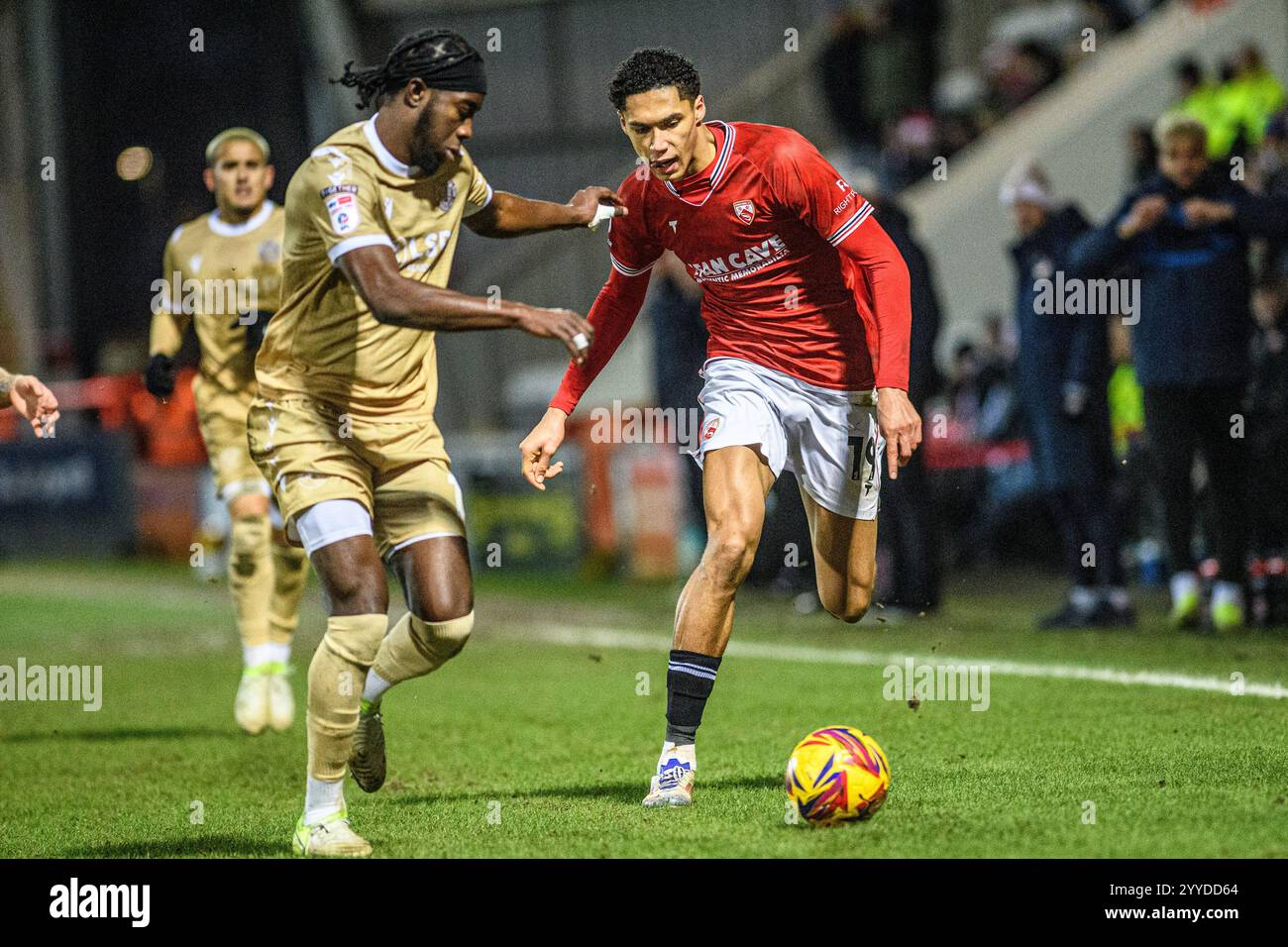 Morecambe FC's Marcus Dackers under pressure from Kamarl Grant of ...