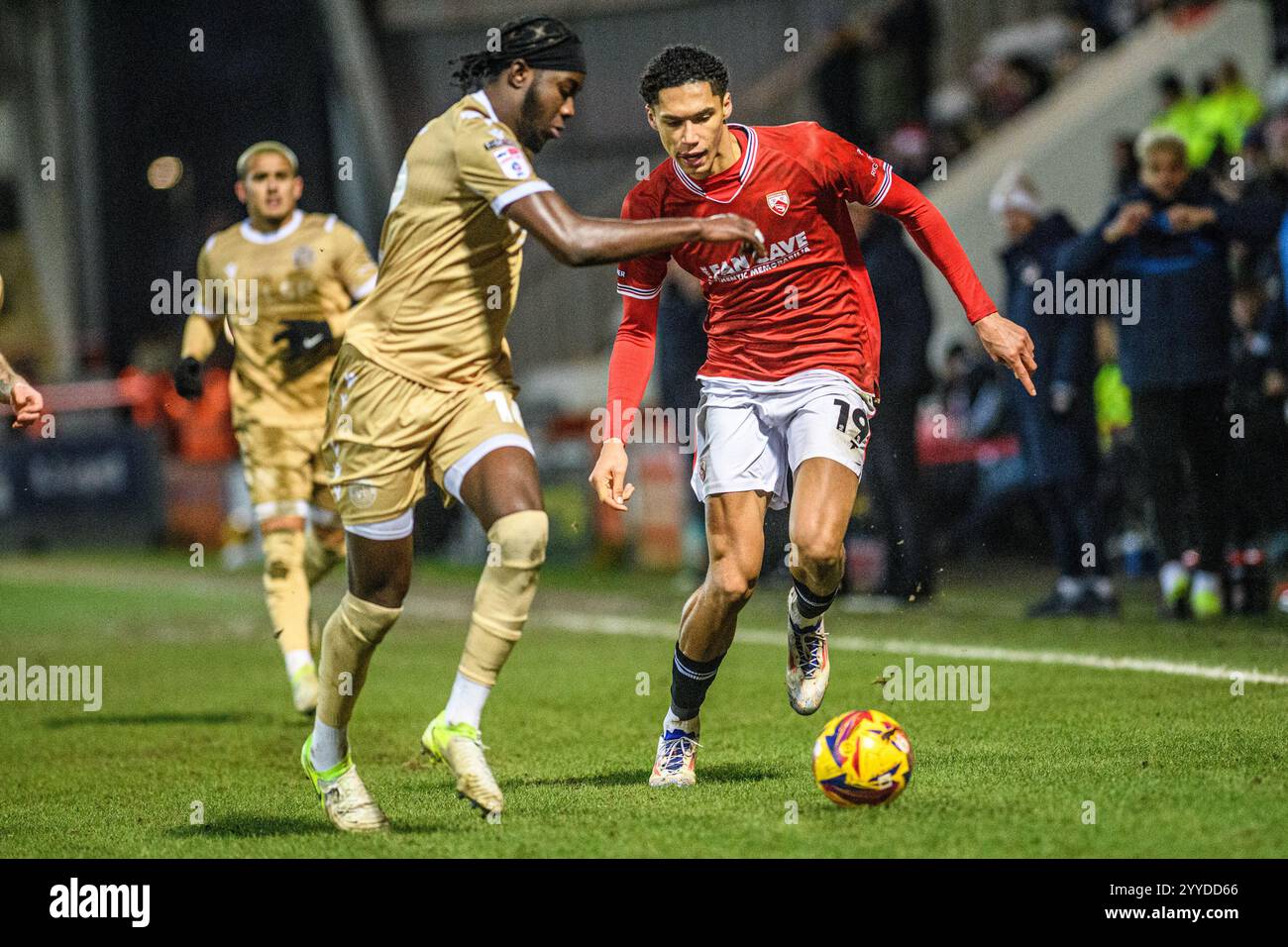 Morecambe FC's Marcus Dackers under pressure from Kamarl Grant of ...